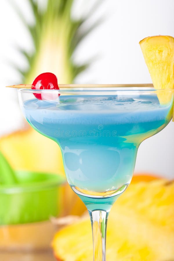 Blue Alcohol Cocktail with Pineapple and Cherry Stock Image - Image of ...