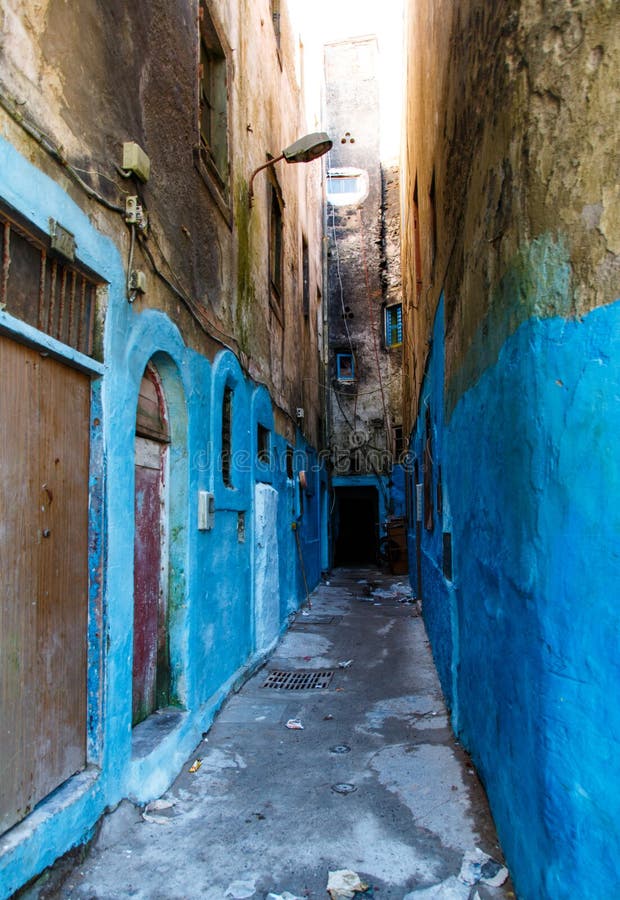 Blue alley with passage stock photo. Image of narrow, doors - 44384