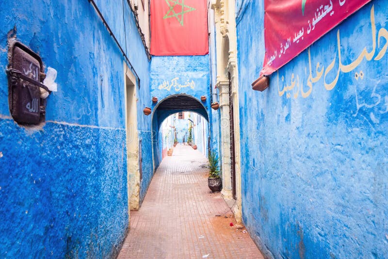 Blue alley with passage stock photo. Image of narrow, doors - 44384