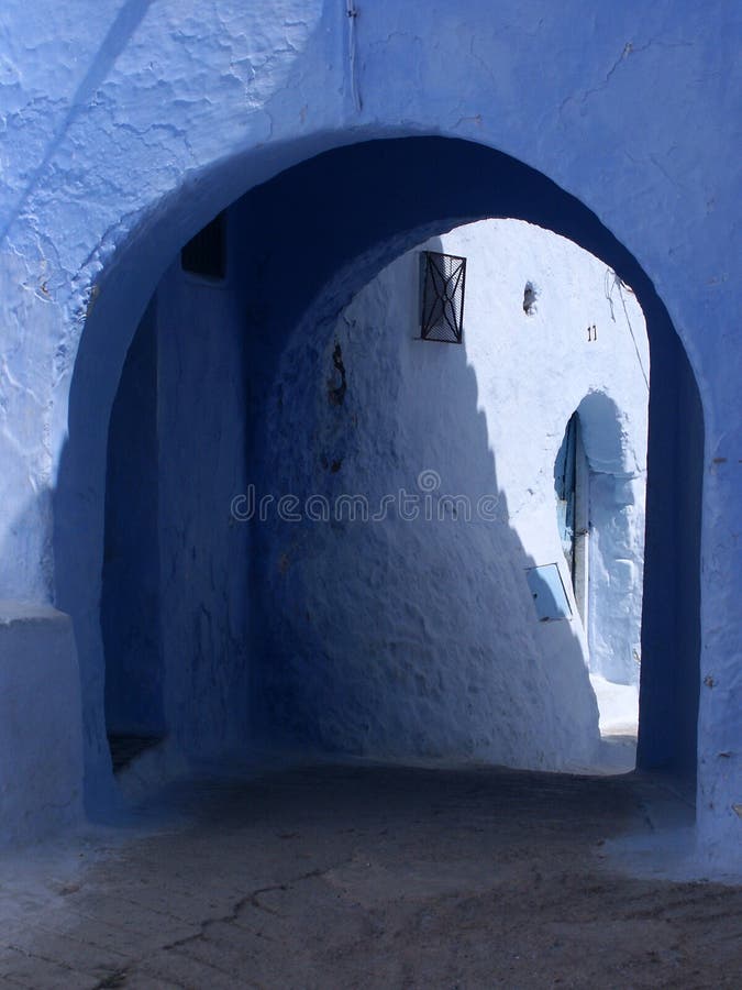 Blue alley with passage stock photo. Image of narrow, doors - 44384