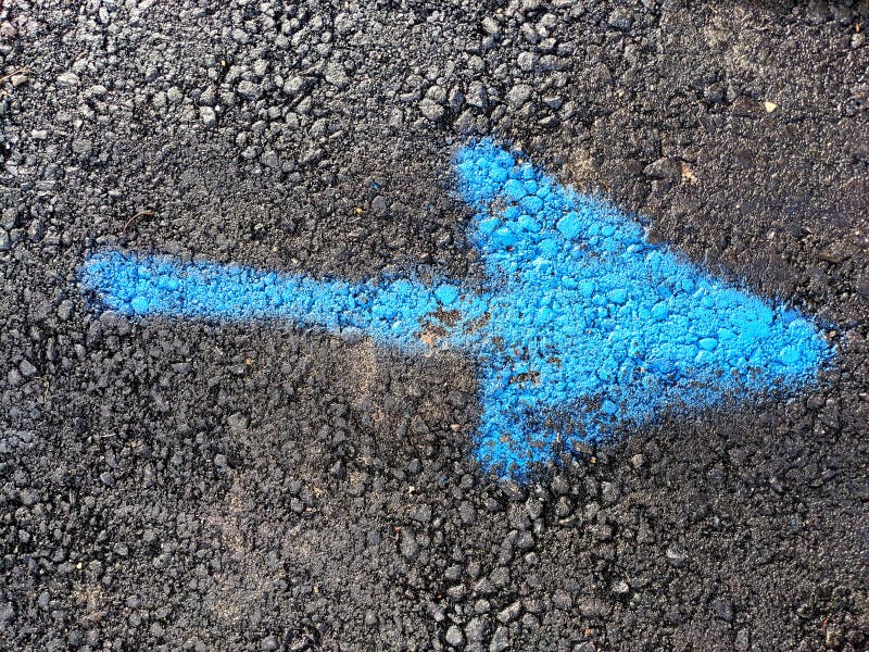 Blue Arrow Painted on Pavement Pointing Stock Photo - Image of arrow ...