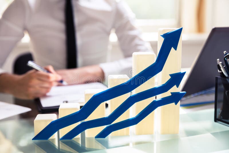 Blue Arrows in Front of Graph Showing Upward Direction Stock Image ...