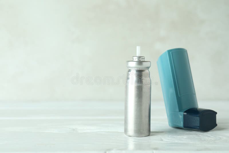 Blue Asthma Inhaler on White Wooden Table Stock Photo - Image of white ...