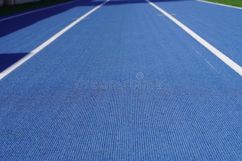 Blue Athletics Track Background with Texture and White Lines Stock ...