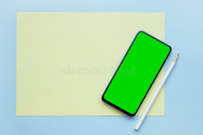 On a Blue Background, a Blank Sheet of Paper, a Phone with a Green ...
