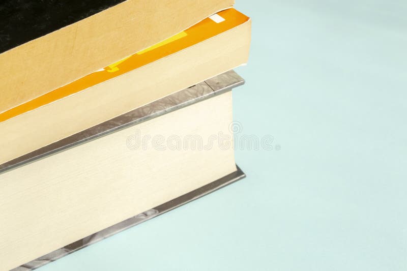 On a Blue Background Lies a Stack of Books. Light Background for ...