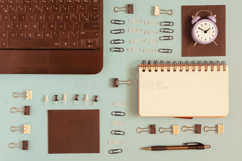 On a Blue Background is a Notebook, in the Corner a Laptop. Staples and ...