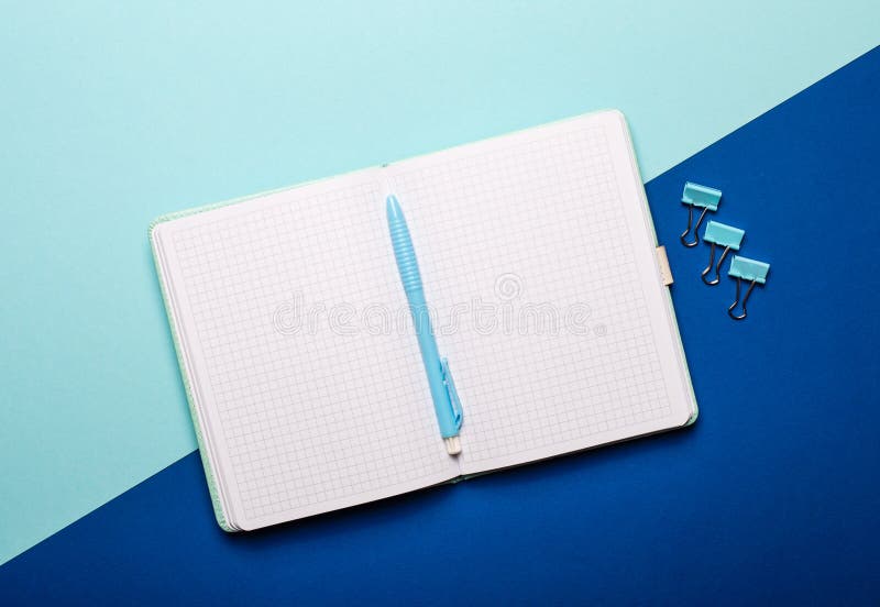 On a Blue and Blue Background - an Open Blank Notebook with a Light ...