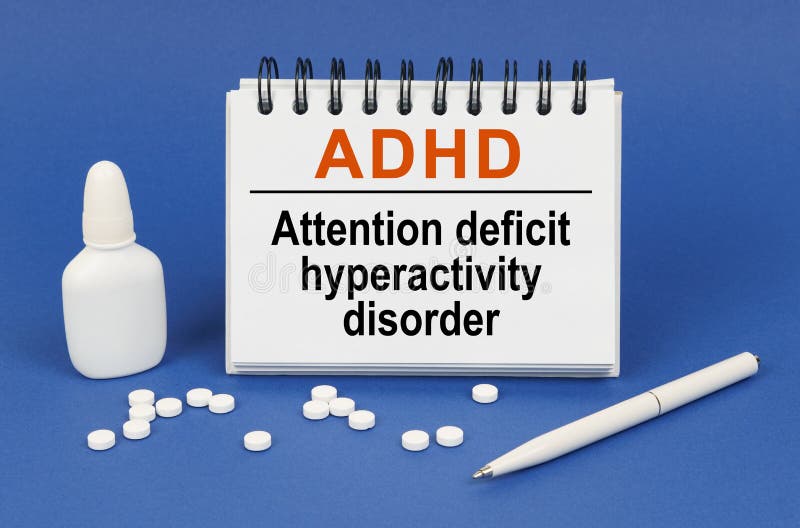 On a Blue Background, a Pen, Tablets and a Notepad with the Inscription ...