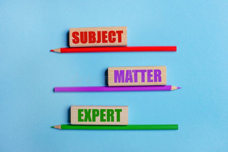 On a Blue Background, Three Colored Pencils, Three Wooden Blocks with ...