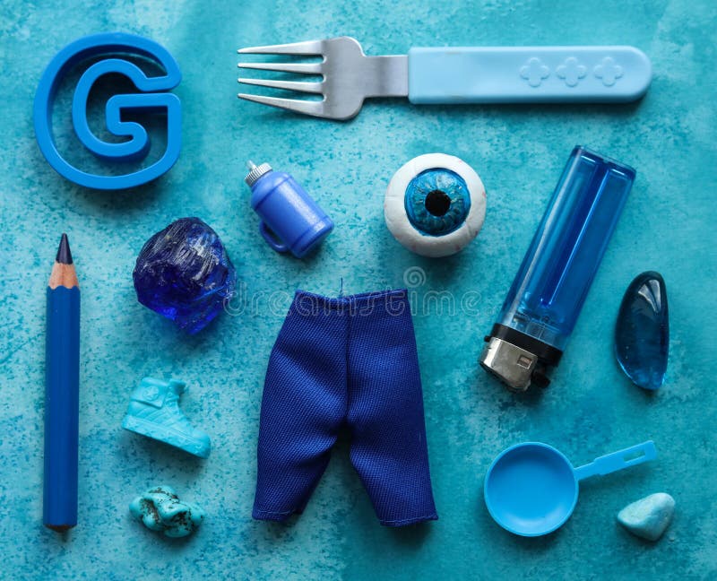 A Blue Background with a Variety of Blue Toys and Items Stock Photo ...
