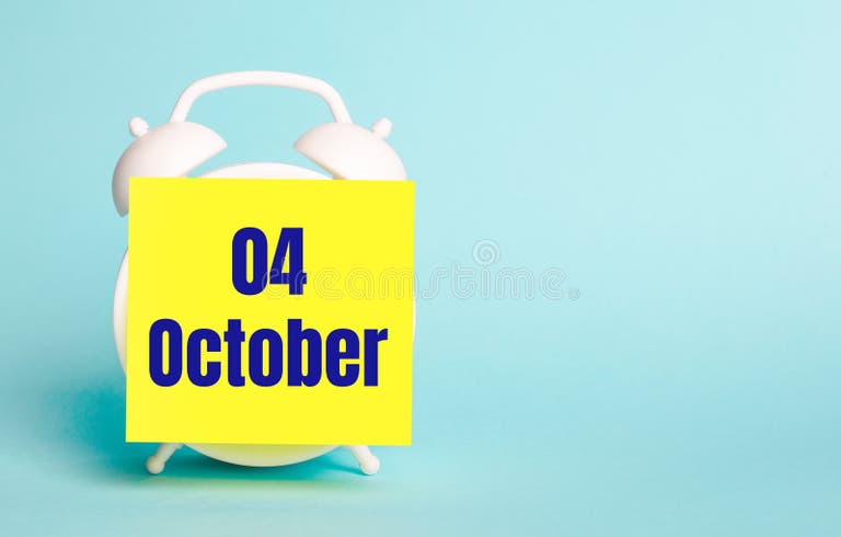 On a Blue Background - a White Alarm Clock with a Yellow Sticker for ...