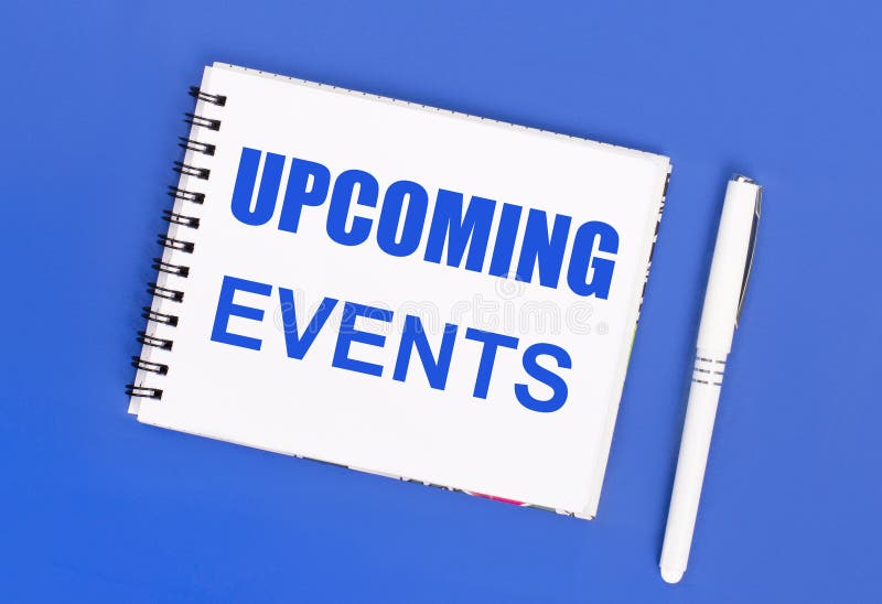 On a Blue Background, a White Ballpoint Pen and a White Notepad with ...