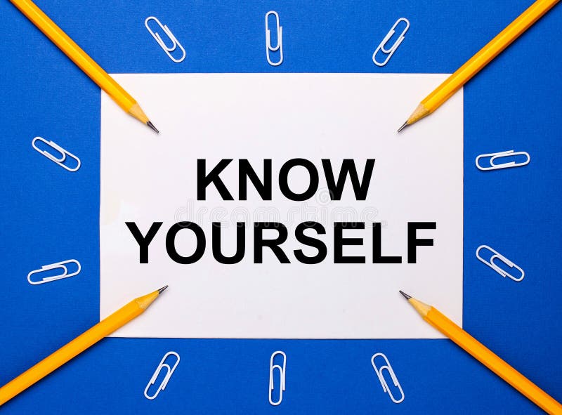 On a Blue Background, White Paper Clips, Yellow Pencils and a White ...