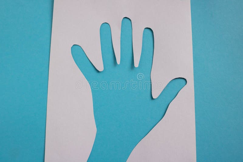On a Blue Background, a White Paper Palm Stencil Stock Image - Image of ...