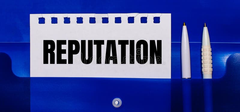 On a Blue Background, White Pens and a Sheet of Paper with the Text ...