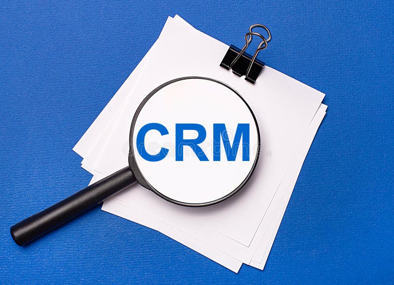 On a Blue Background, White Sheets Under a Black Paper Clip and on Them ...