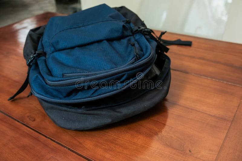 Blue Backpack with Books and Laptop Inside for Student or Working on ...