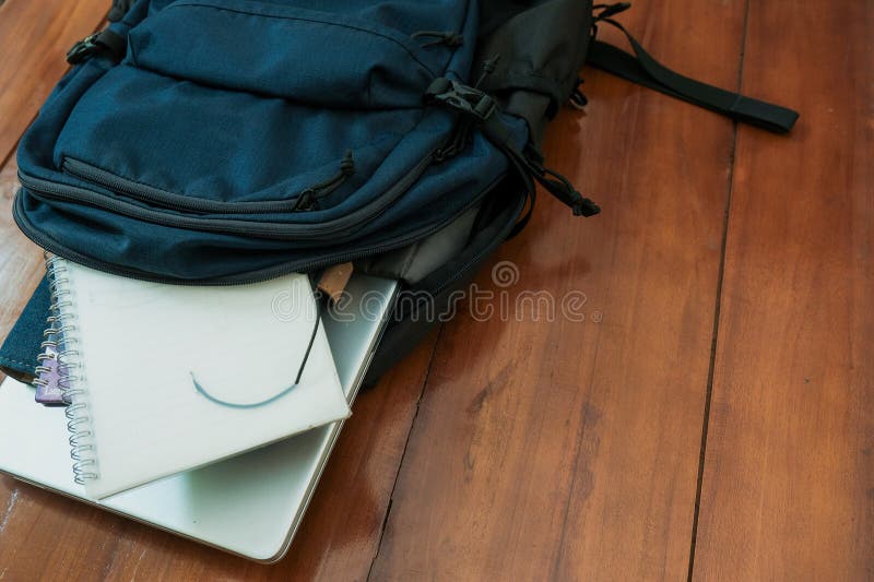 Blue Backpack with Books, Notepad and Laptop for Student or Working on ...