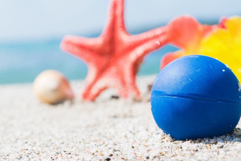 Blue Ball and Objects on the Sand Stock Image - Image of ball, bright ...