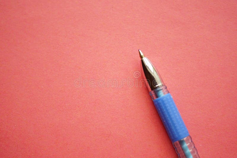 Blue Ballpoint Pen on Red Paper Stock Photo - Image of ballpoint, note ...