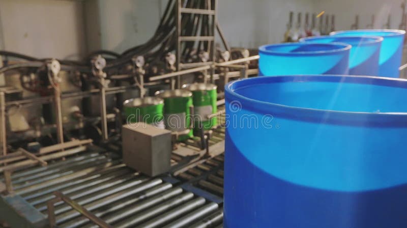 Blue Barrels on an Automated Line in a Factory. the Process of ...