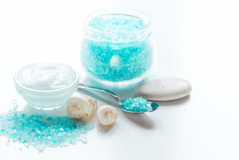 Blue Bath Salt, Body Cream and Shells for Spa on White Table Background ...