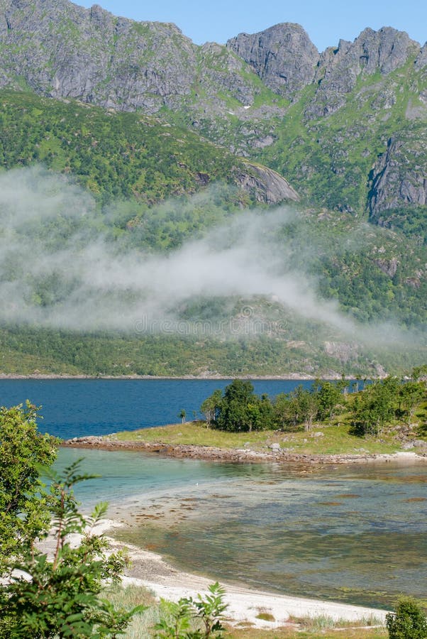 Blue Bay on a Background of Mountains in the Cloud Stock Photo - Image ...
