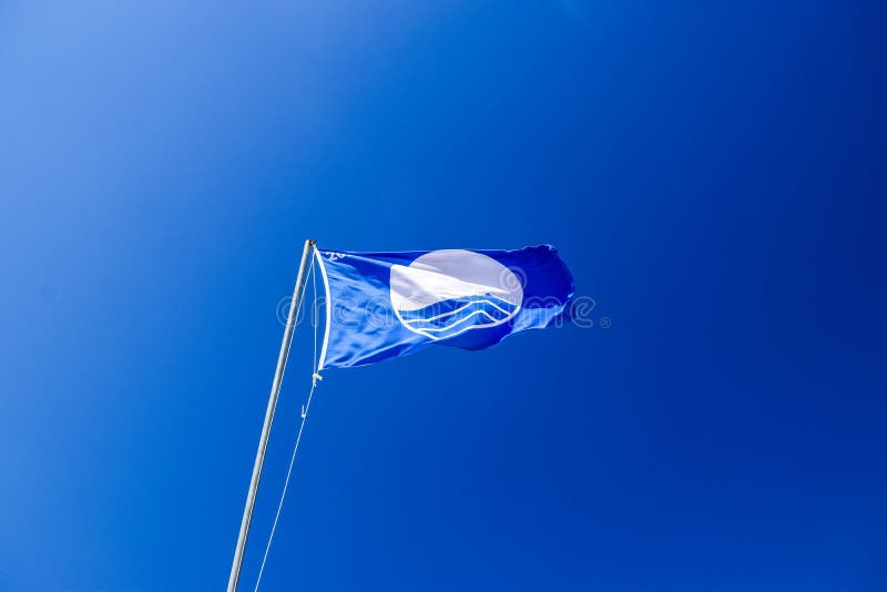 Blue beach flag editorial photography. Image of clean - 162230752