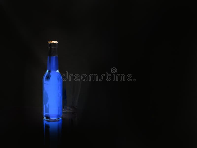 A Blue Beer Bottle Isolated on Black Background Stock Image - Image of ...