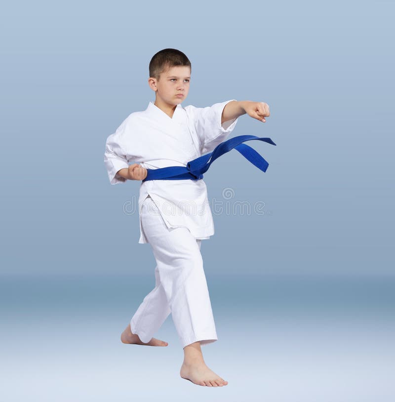 With a Blue Belt Karate Athlete Beats Punch Arm Stock Photo - Image of ...
