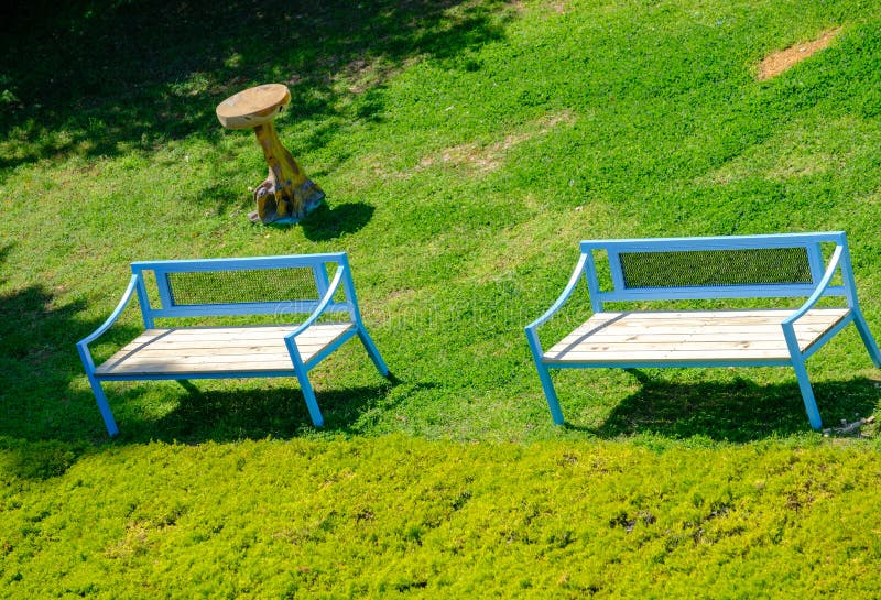 Blue Benches and a Side-table on Grass at a Park. Suitable As a ...