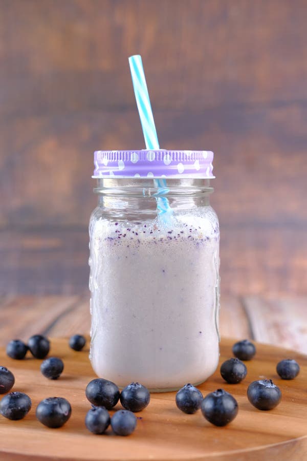 Blue Berry Milk Shake in a Glass on Table Stock Image - Image of ...