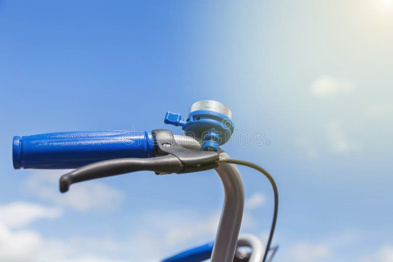 Blue Bicycle Bell with Blue Grip on Handle Bar Stock Photo - Image of ...