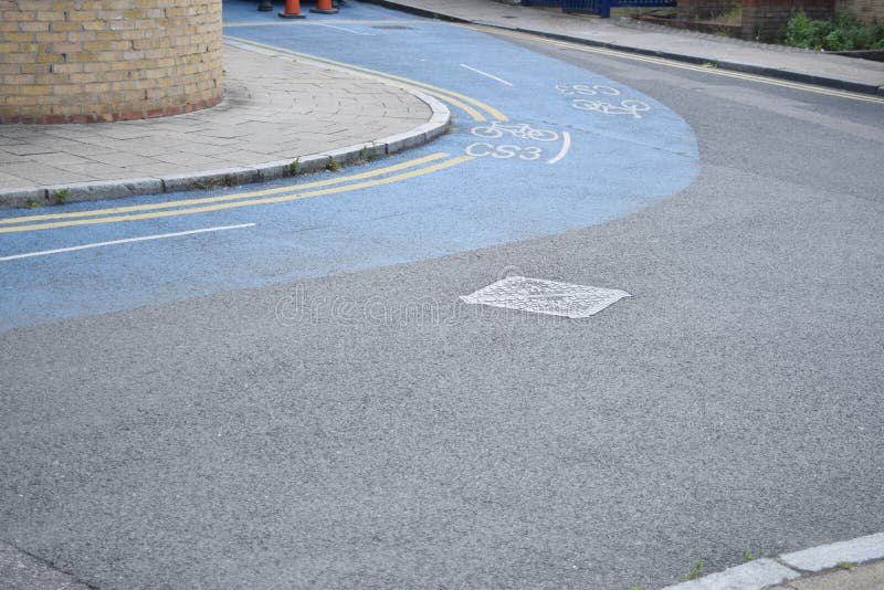Blue Bicycle Lane in a Sharp Corner Turn Stock Image - Image of bicycle ...