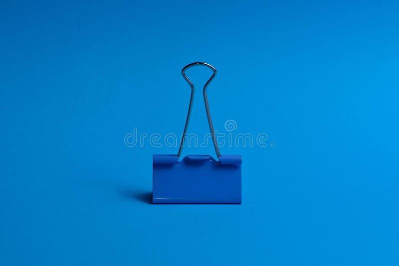 Blue Binder Clip on Blue Background Stock Image - Image of clips ...