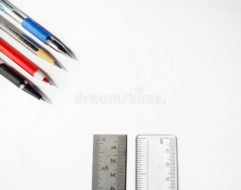 Blue Black and Red Pens a Pencil a Metal Scale and a Plastic Scale on ...