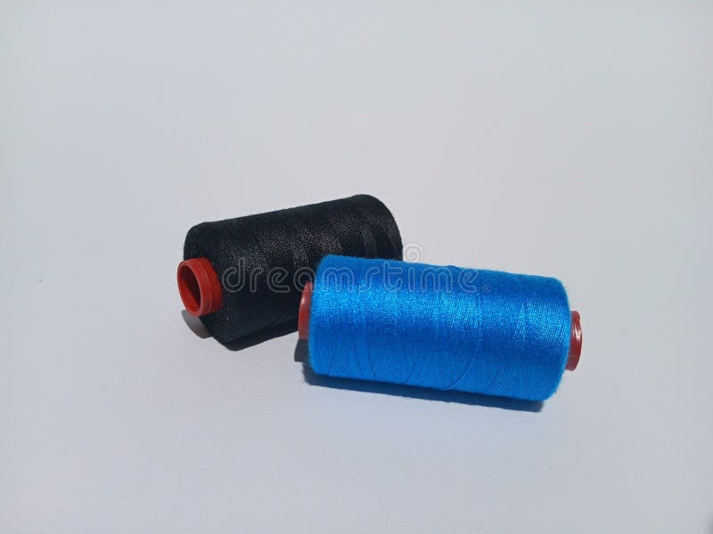 Blue and Black Sewing Thread on White Background Stock Image - Image of ...