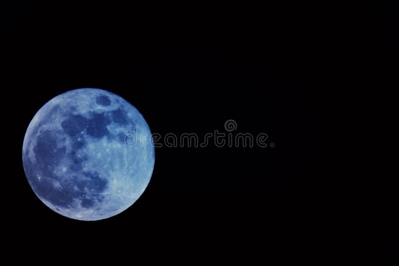 Blue moon with red tint stock photo. Image of event - 108968846