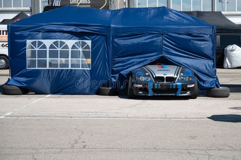 Blue BMW E46 Covered Tuned for Drift Competitions Behind a Tent ...