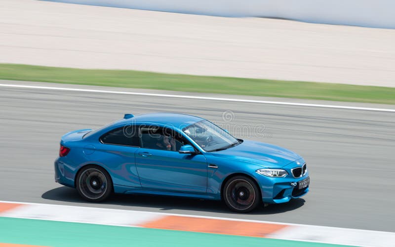 Blue BMW M2 Driving Around on a Race Track Editorial Stock Photo ...