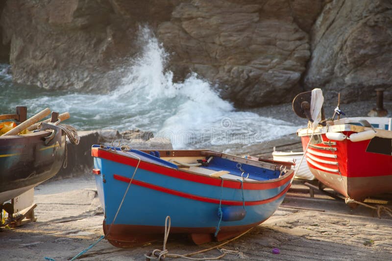 Blue boat stock image. Image of coast, scene, boat, rocks - 1269905