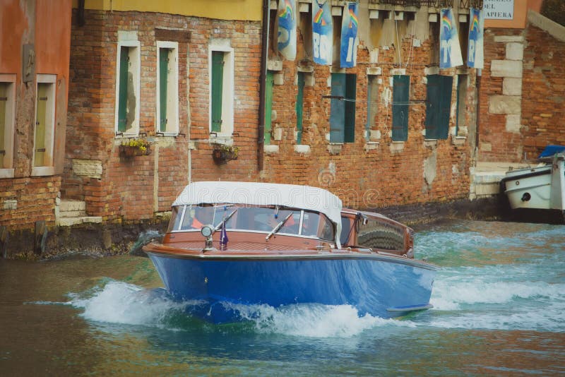 Blue boat in a canal editorial stock photo. Image of blue - 268370803