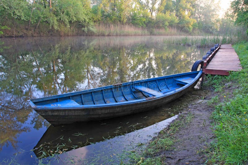 Blue boat on river stock photo. Image of cane, river, transport - 9344924