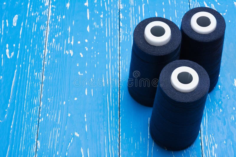 Blue Bobbin Thread on Vintage Painted Wooden Table. Copy Space Stock ...