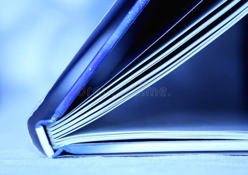 Blue book on the table stock photo. Image of learning - 56422806