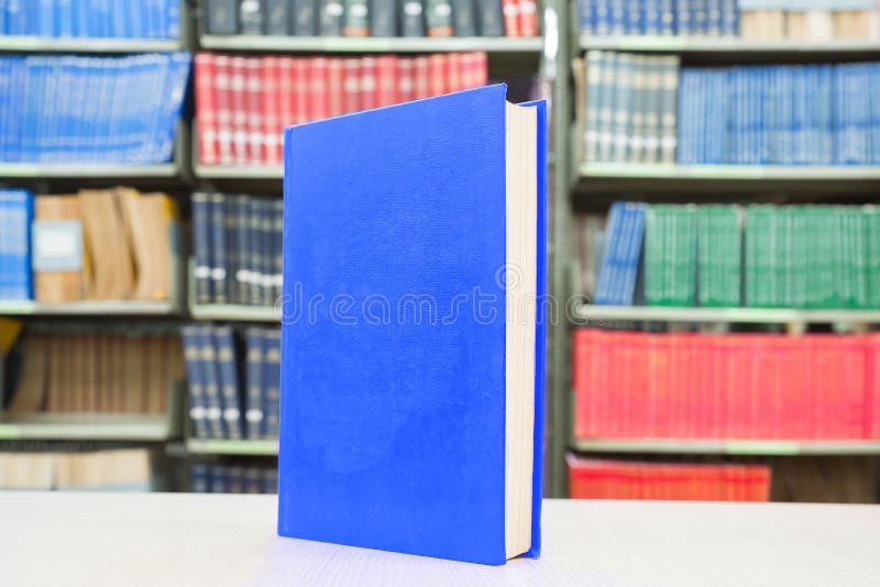Book in a Bookshelf Standing Out at University Library. Stock Photo ...
