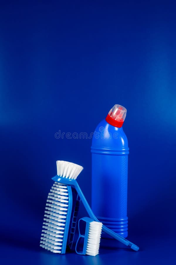Blue Bottle with Detergent Powder and Brushes on Blue Background, Space ...