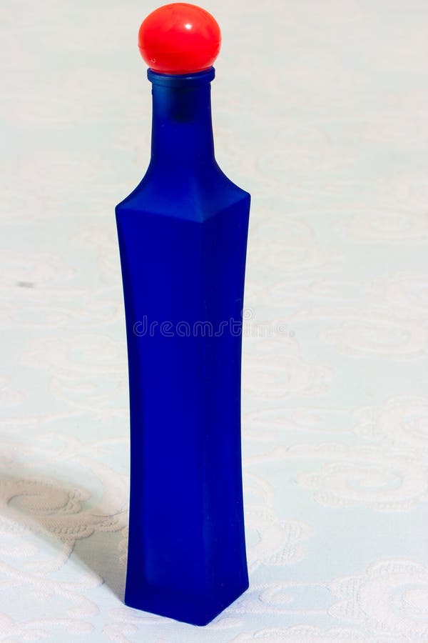 Blue bottle stock image. Image of bottle, flower, dafodil - 305871845