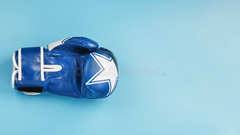Blue Boxing Glove on a Blue Background, Free Space Stock Image - Image ...